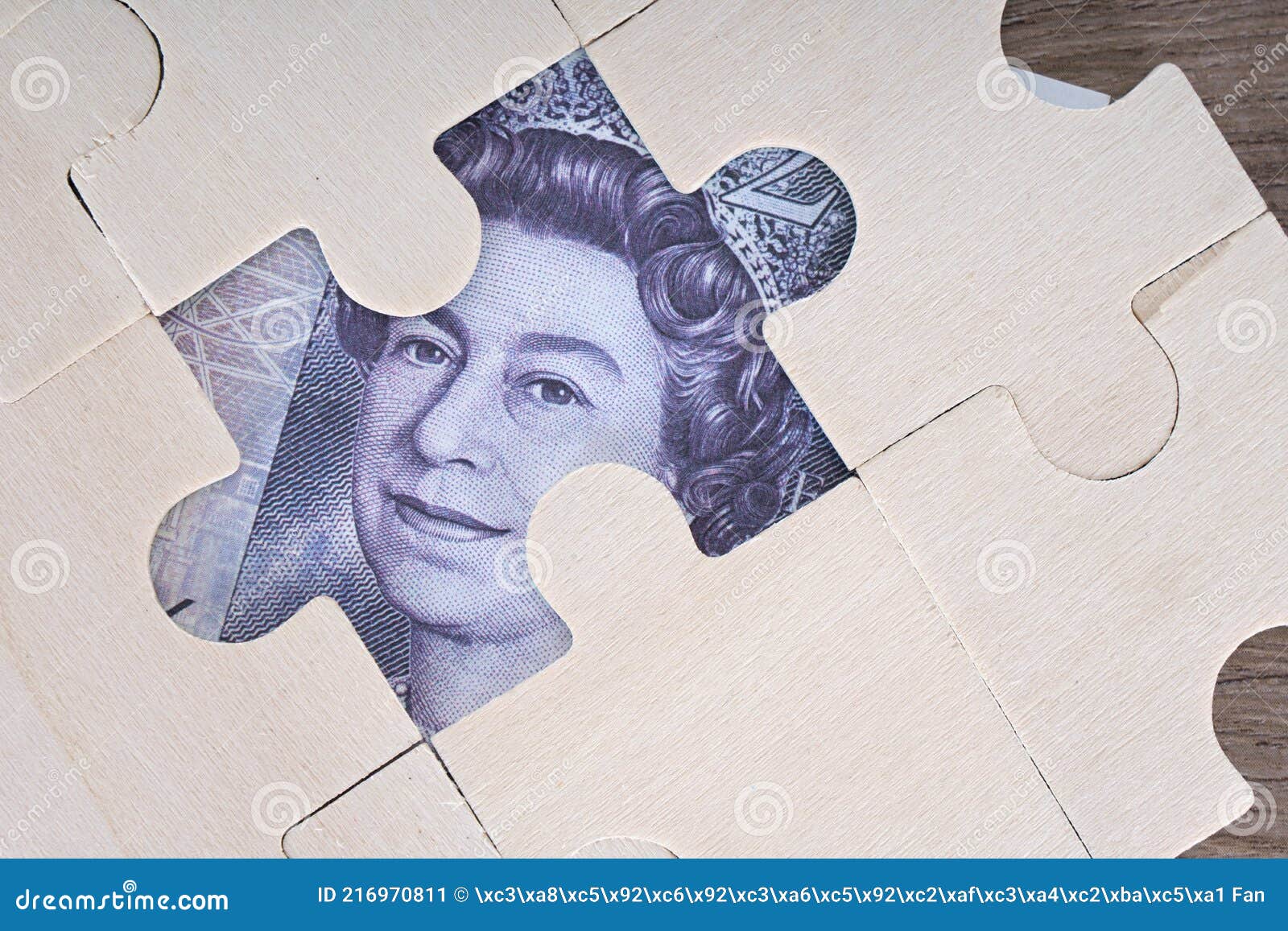 Pound Banknote Exposed from Jigsaw Puzzle on Table Editorial Photo ...