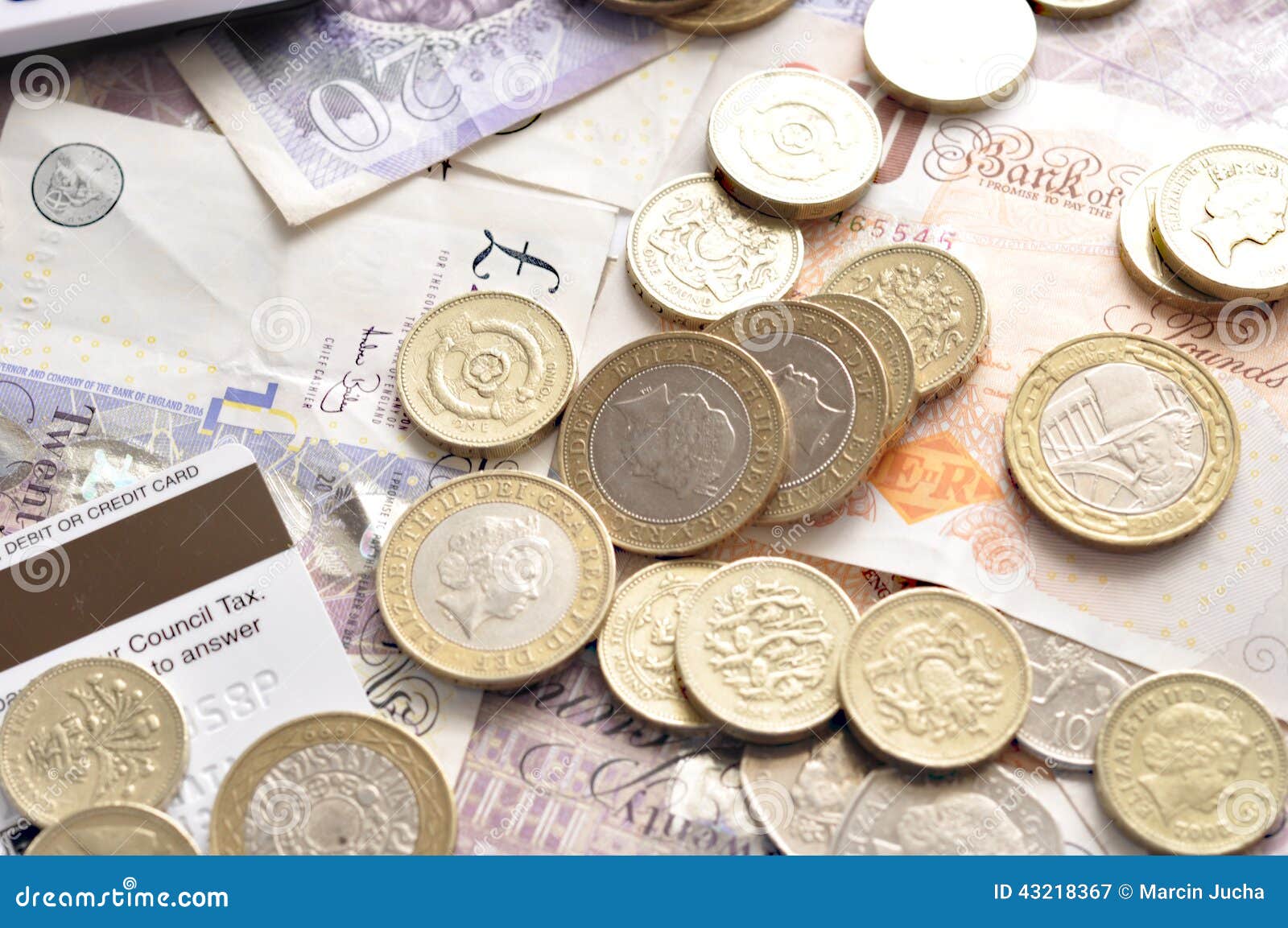 Pound notes and coins editorial photography. Image of coin - 43218367