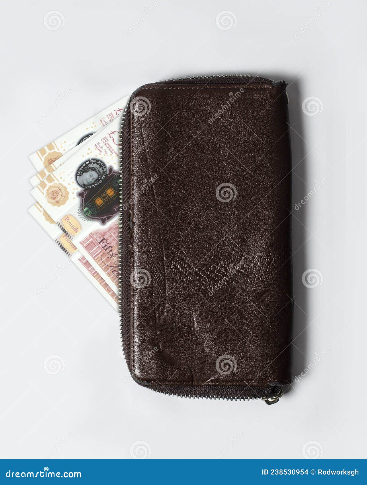 50 Pound Notes Inside a Purse. Pounds Popping Out of a Brown Leather ...