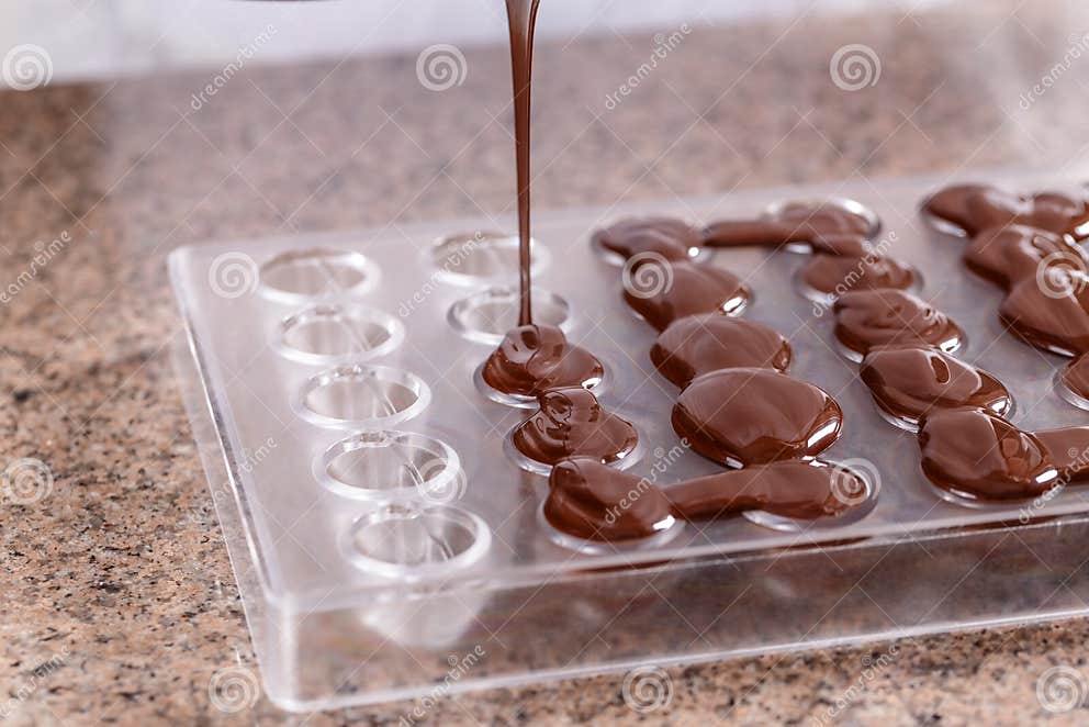Pour liquid chocolate stock photo. Image of homemade - 77130732