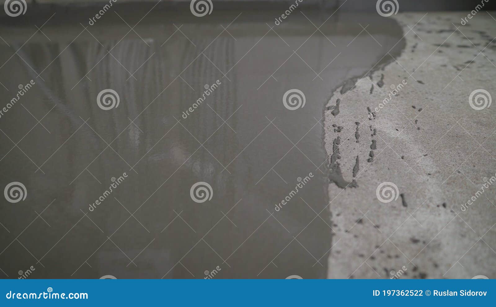 Pour the Liquid Floor Onto the Concrete Surface. Leveling the Floor ...