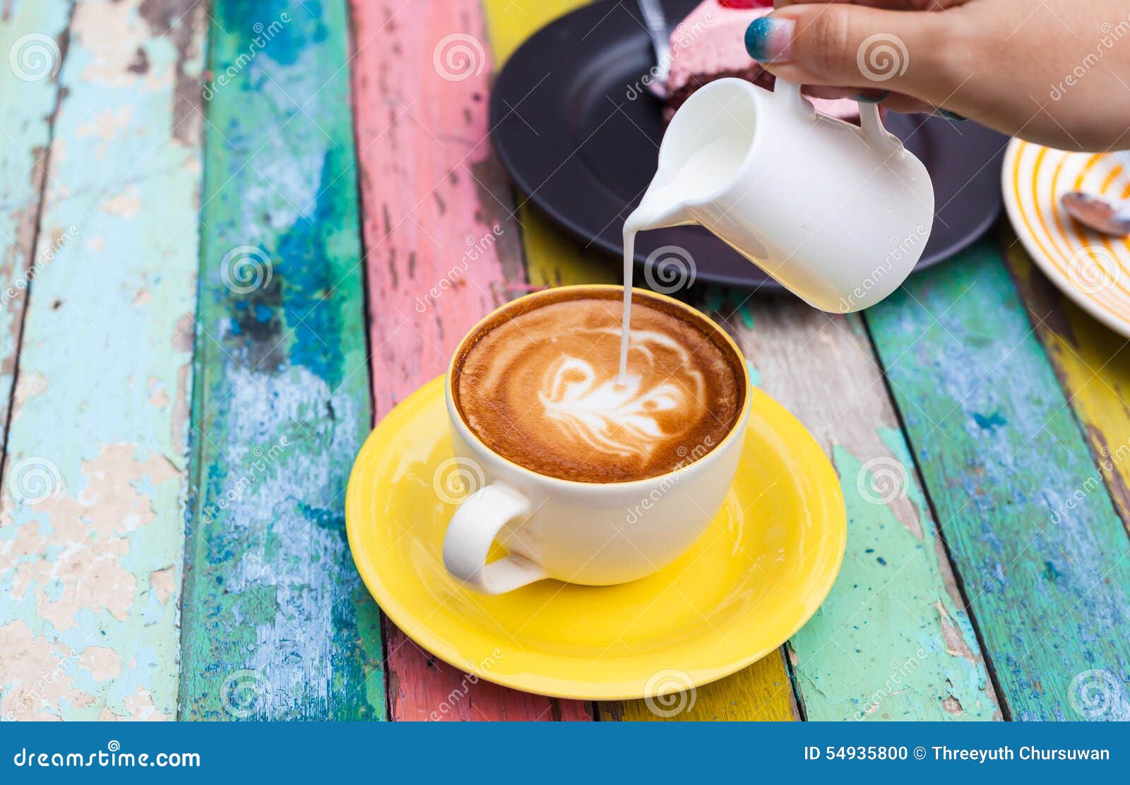 Pour milk to Coffee cup stock photo. Image of pouring - 54935800