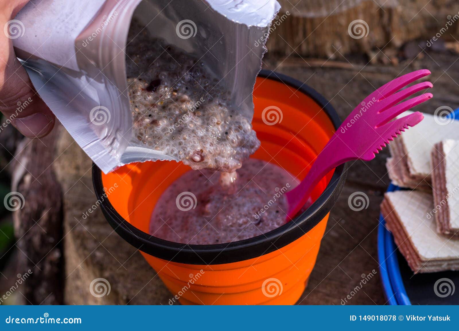 Pour Out Food from the Package. Pour Food into the Dishes Stock Photo ...