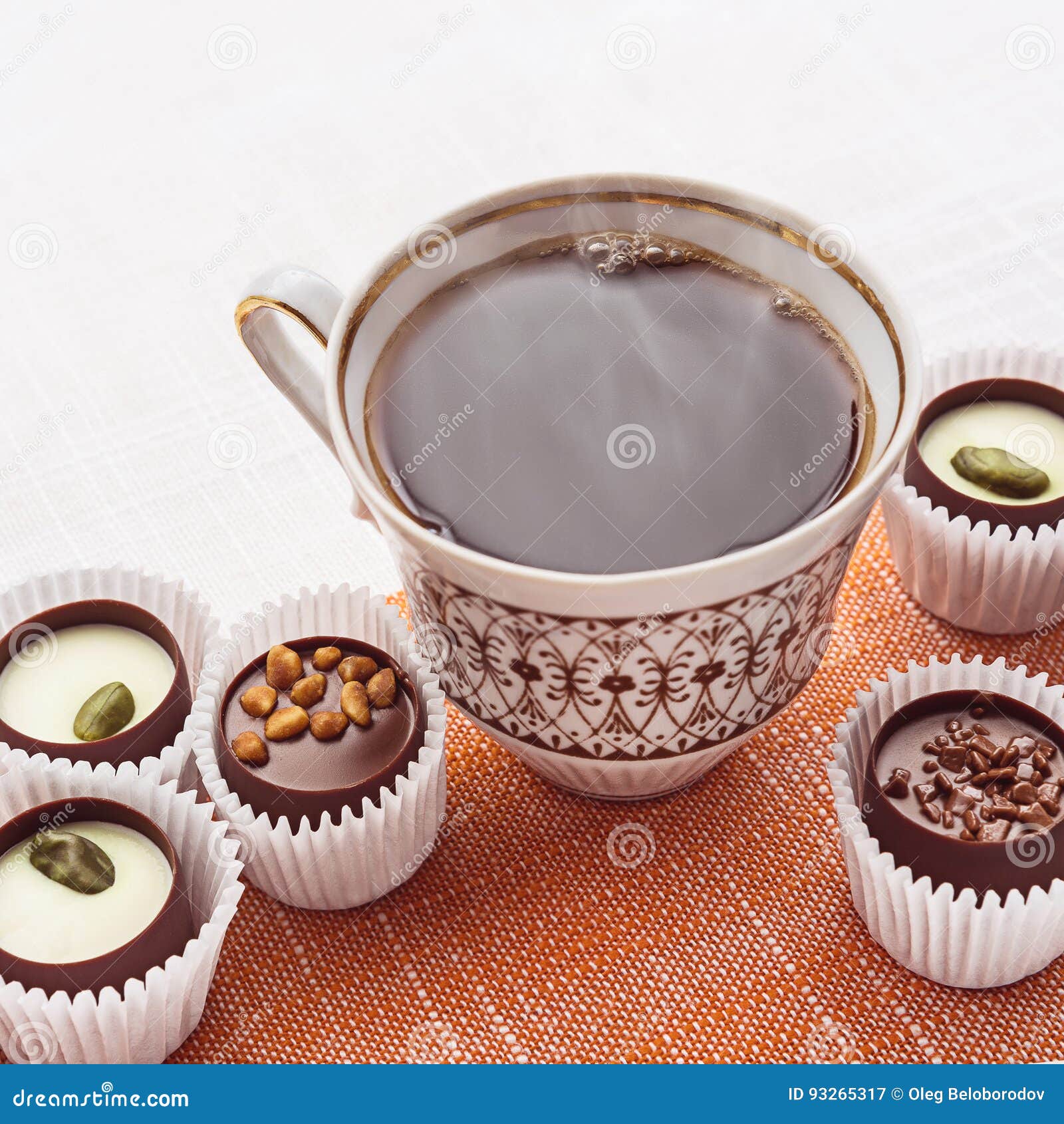 Pour Tea into a Cup of Tea and Chocolate Candies. Stock Image - Image ...