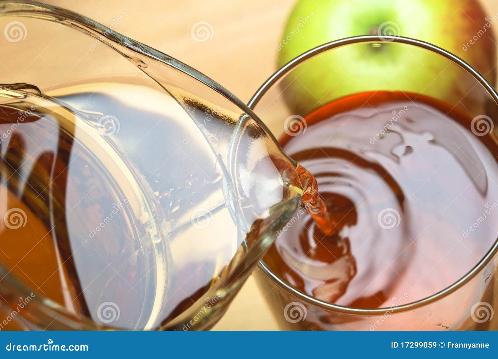 Pouring Apple Juice stock image. Image of spilling, filling - 17299059