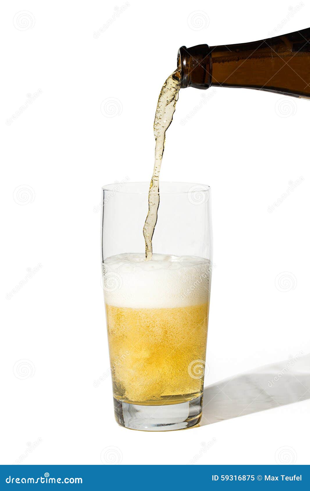 Pouring beer from a bottle stock image. Image of high - 59316875
