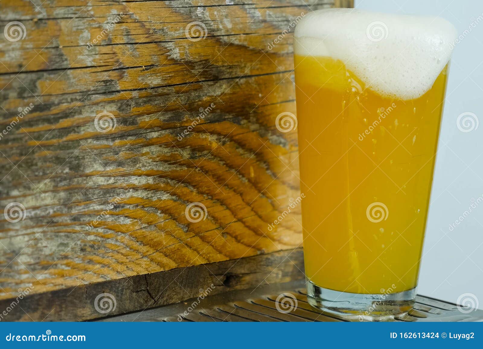 Pouring Beer Into A Glass From The Tap At Bar Beer Bottling Stock