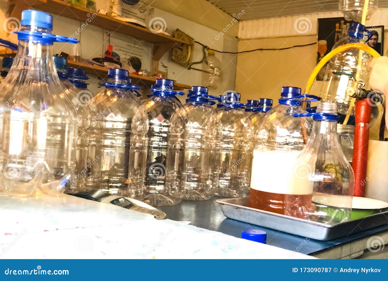 Pouring Beer into Plastic Bottles Stock Image - Image of lager ...