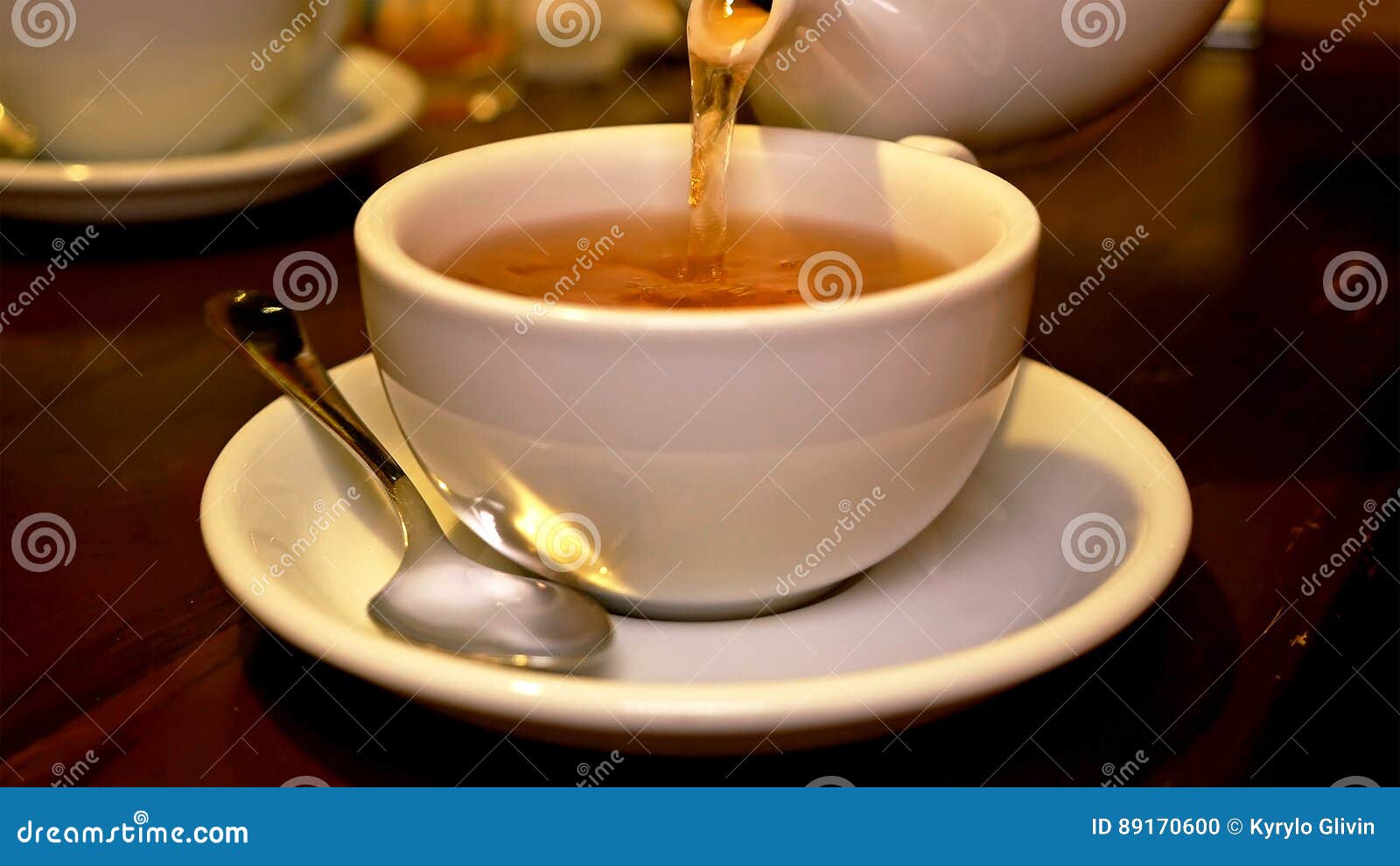Pouring Black Tea into Cup from Teapot Stock Photo - Image of dinner ...