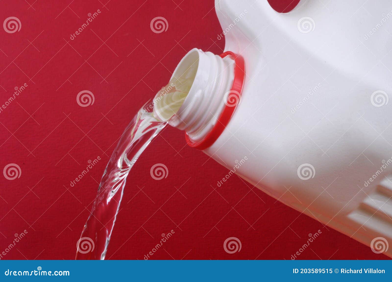 Pouring Bleach Close Up on Red Background Stock Image - Image of ...