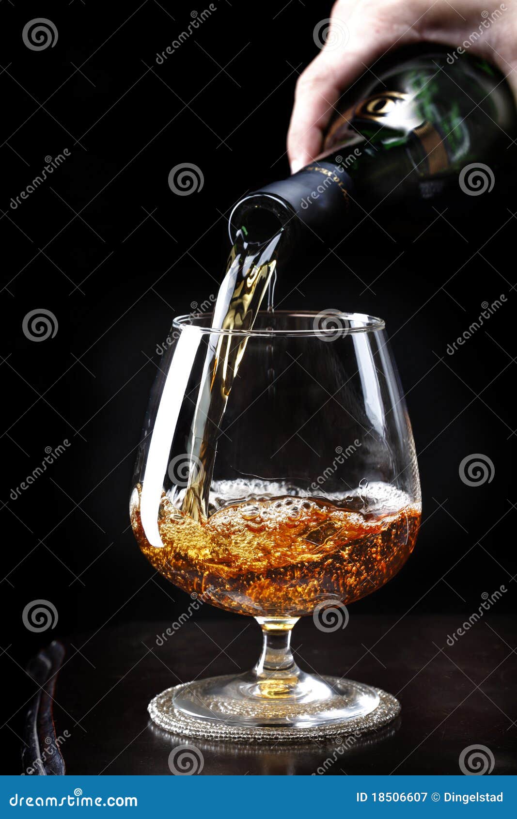Pouring brandy stock image. Image of flowing, beverage - 18506607