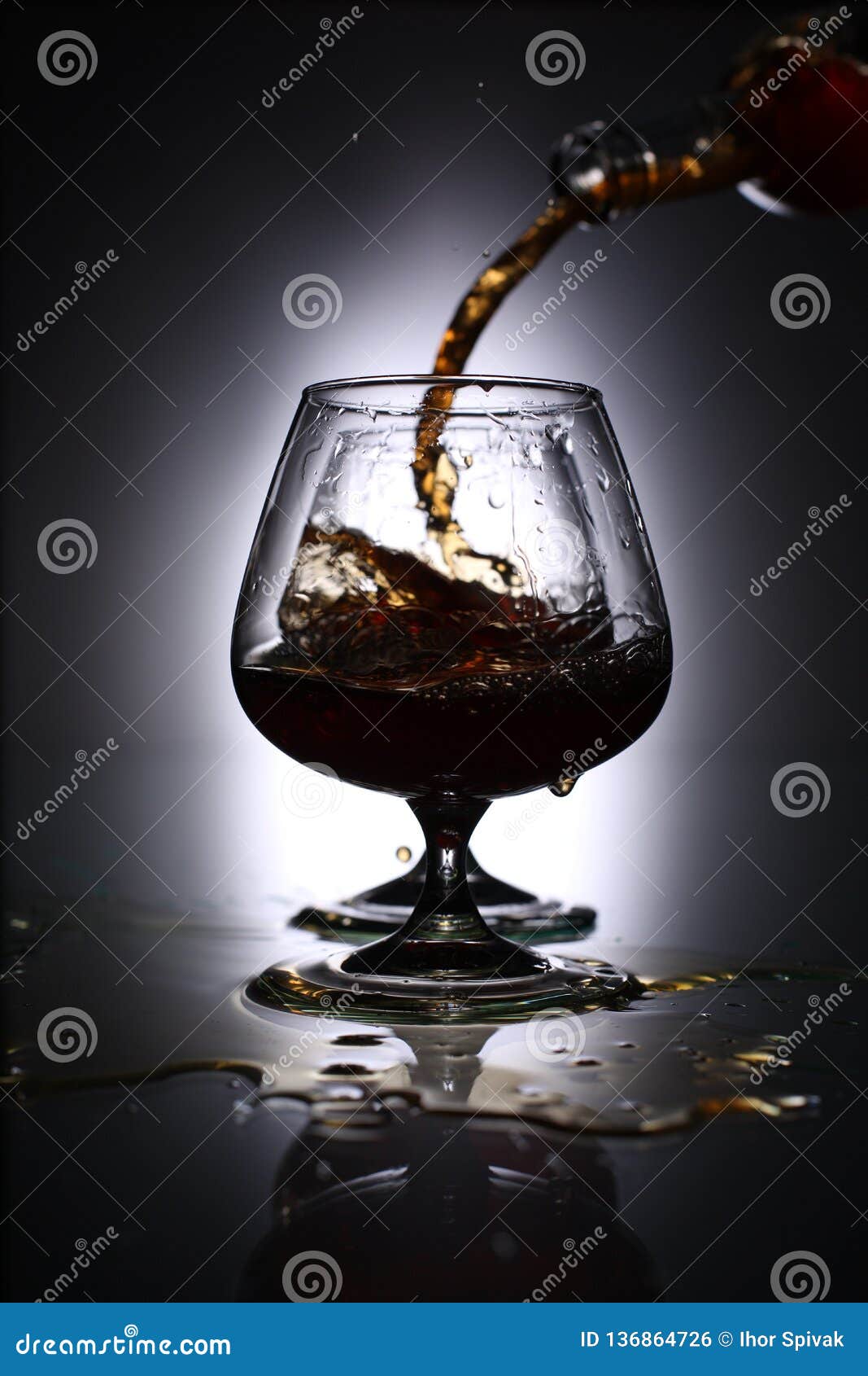 Pouring Brandy into a Glass Stock Photo - Image of movement, bloom ...