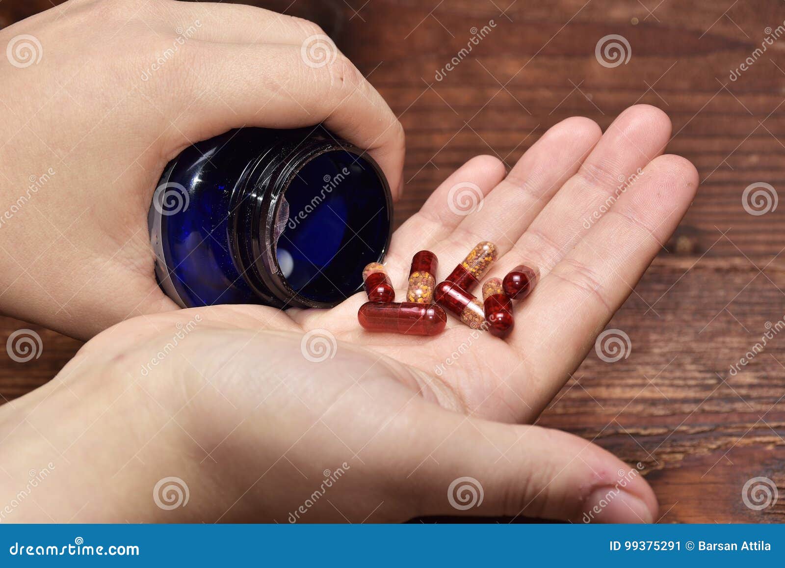 The Pouring Capsules from a Pill Bottle into Hand Stock Image - Image ...