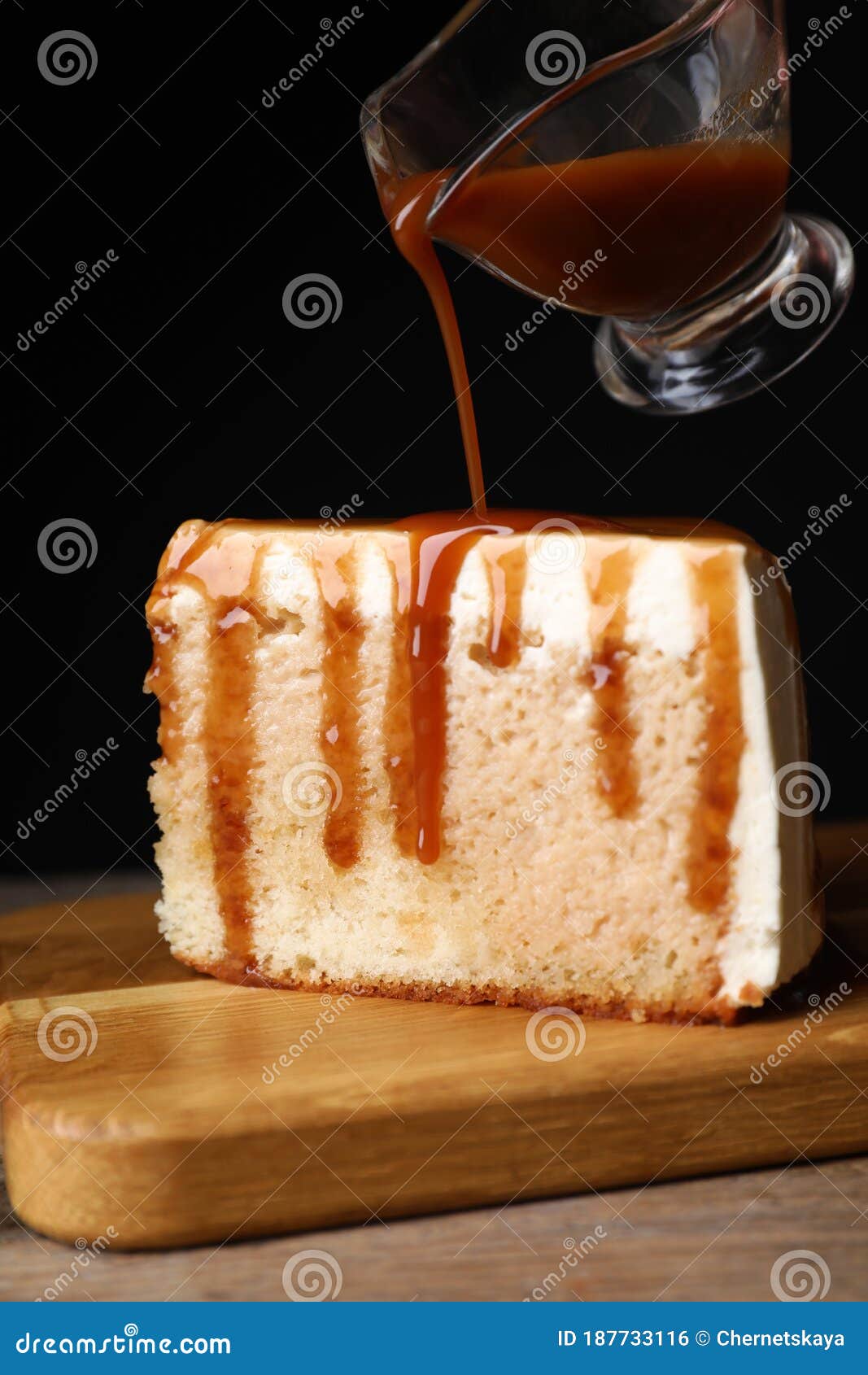 Pouring Caramel Sauce on Slice of Cake at Table Stock Photo - Image of ...