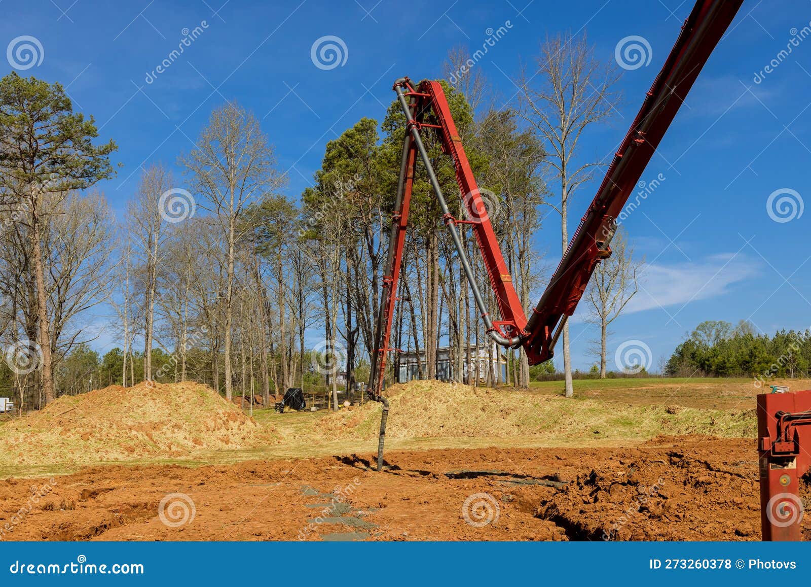 Pouring Cement Concrete for the Foundation of a Building Using an ...