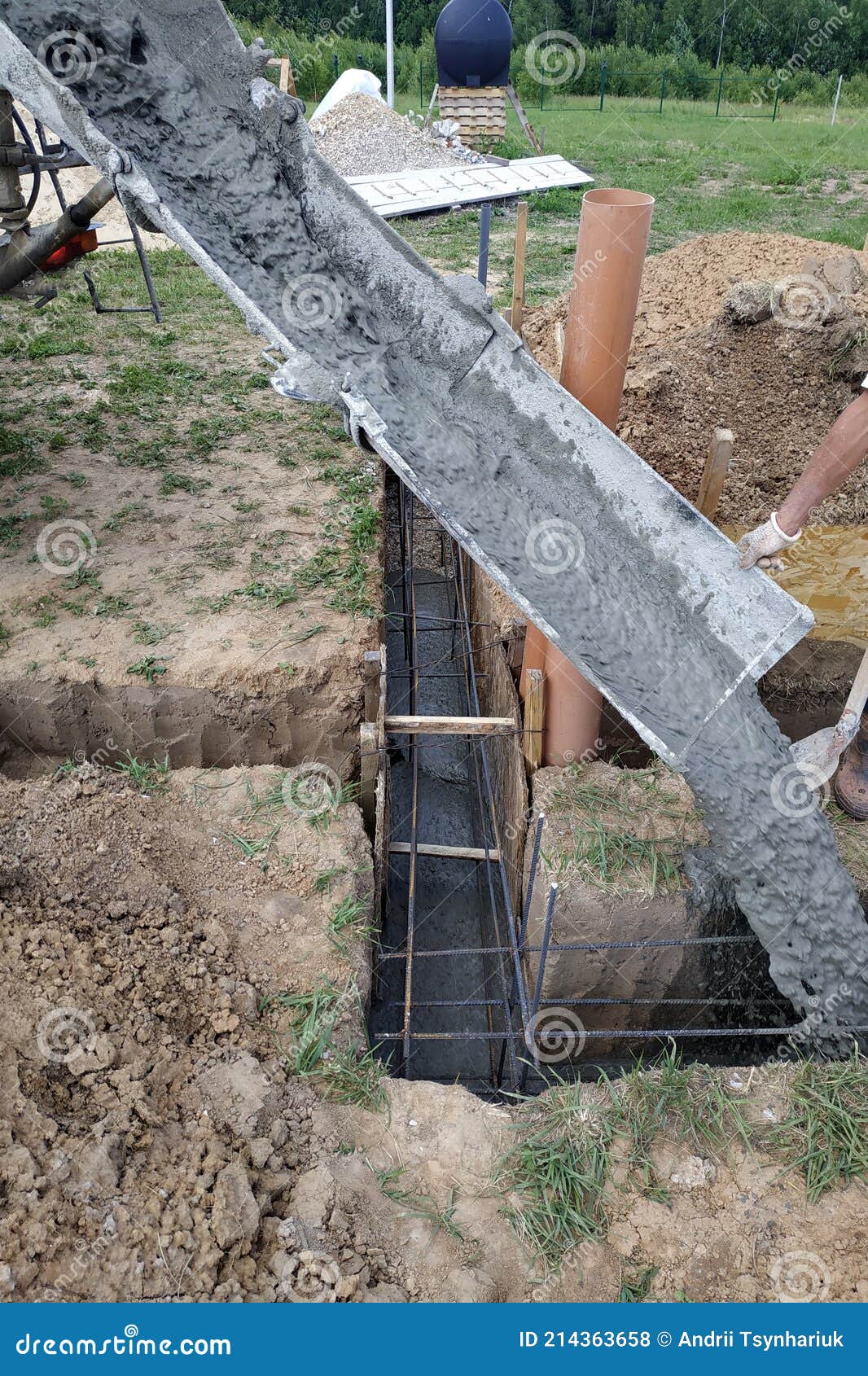 Pouring Cement into the Trench with a Mixer, Construction Work in the ...