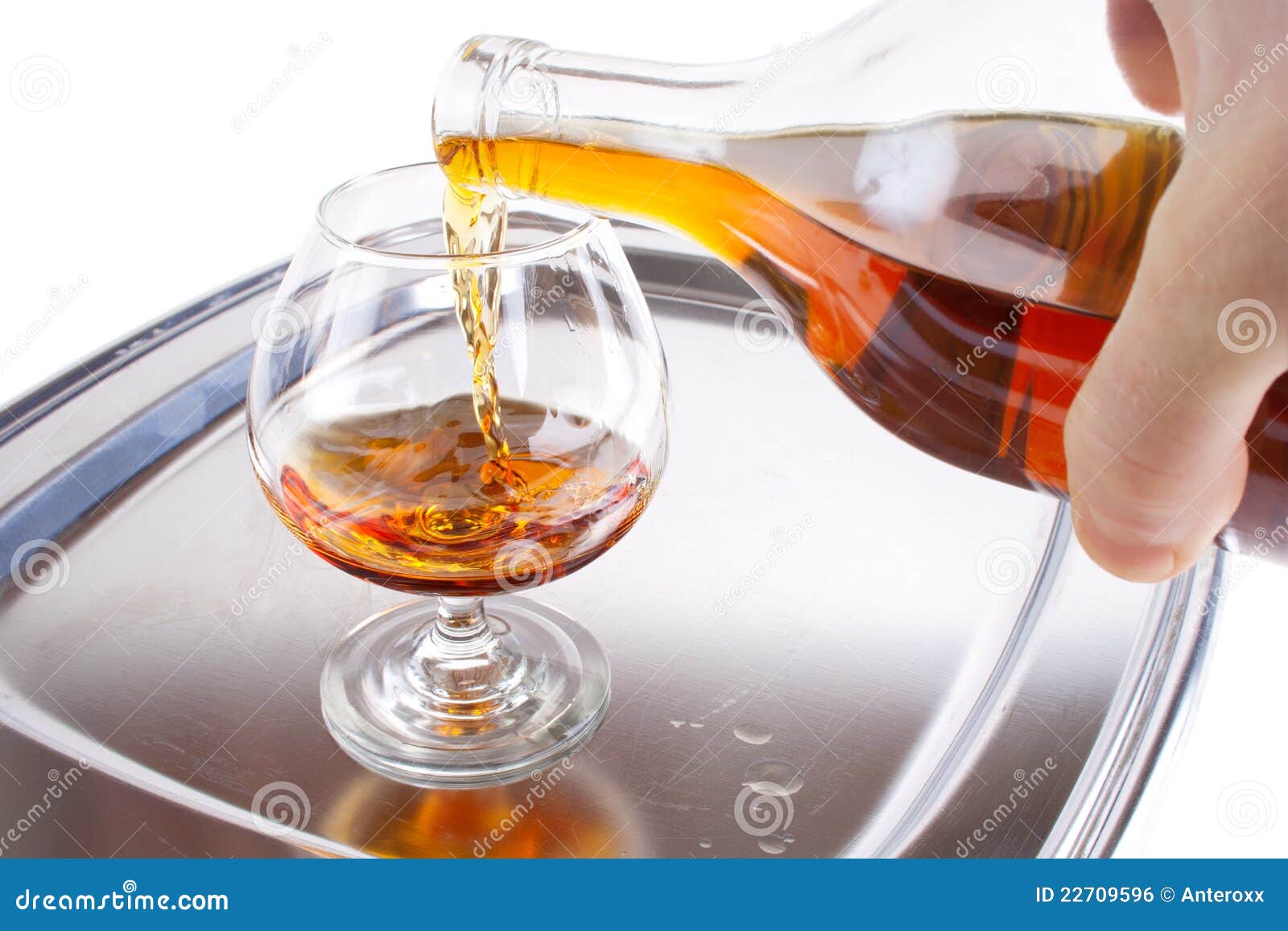 Pouring cognac stock photo. Image of liquor, holding - 22709596