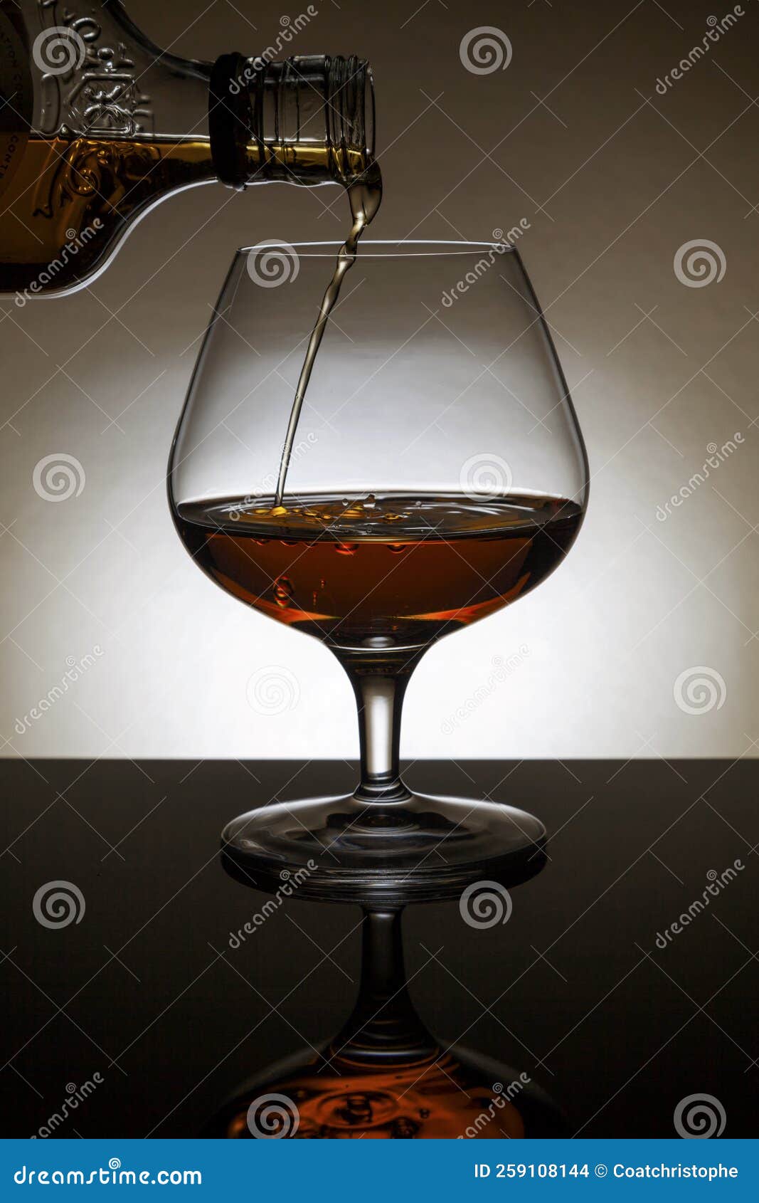 Cognac in a Back-lite Glass Stock Photo - Image of black, drinking ...