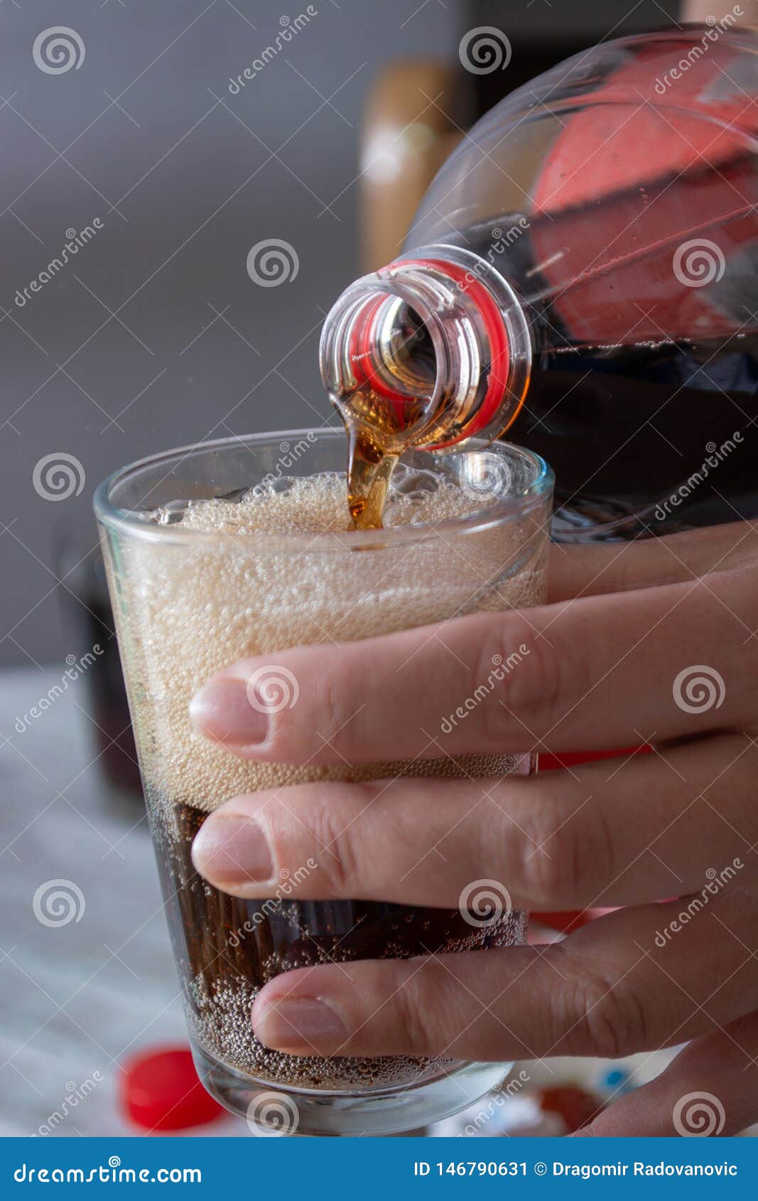 Pouring coke in the glass stock image. Image of pouring - 146790631