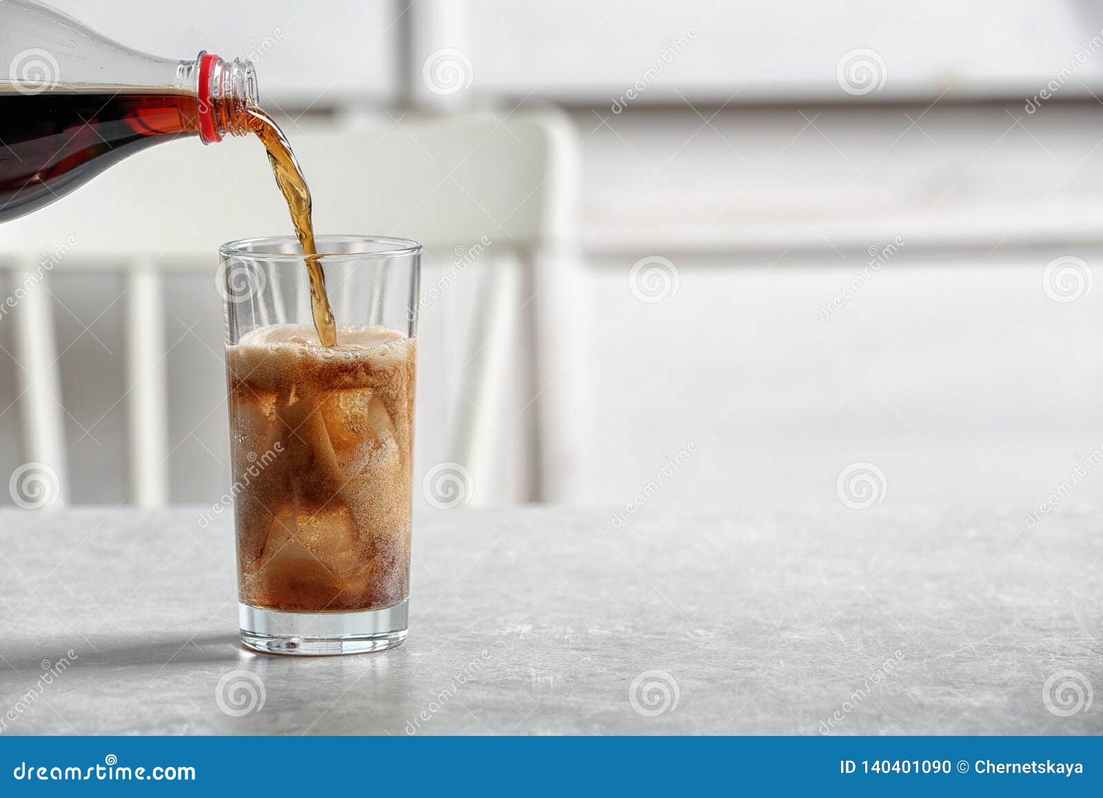Pouring Cola from Bottle into Glass on Table. Stock Photo - Image of ...