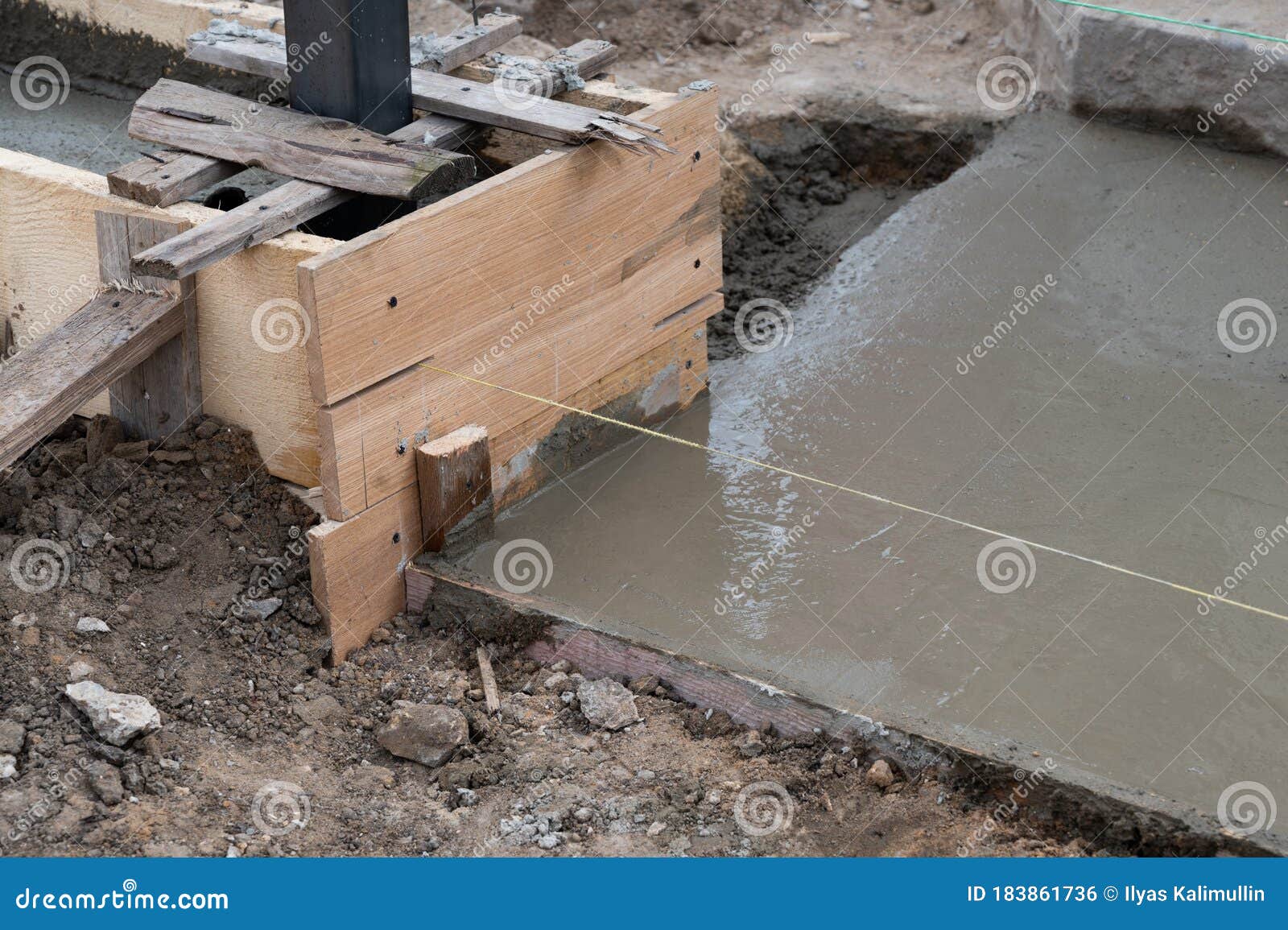 Pouring Concrete into Formwork for New Fence Stock Photo - Image of ...