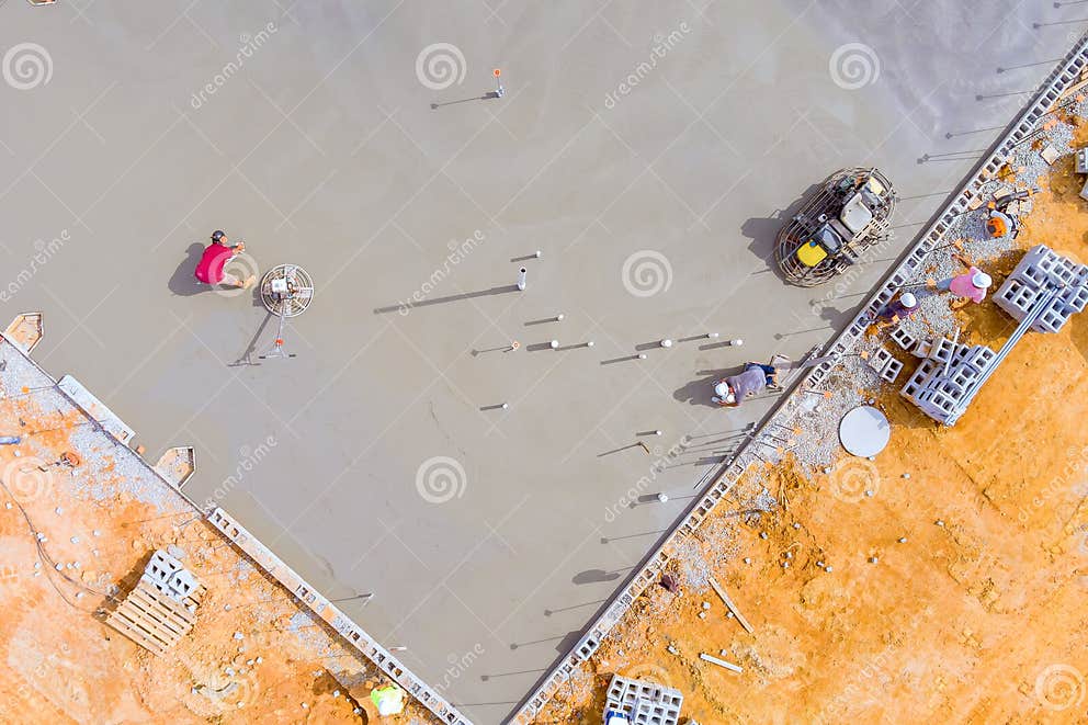 After Pouring Concrete Foundation, Leveling Was Done by Workers Using a ...