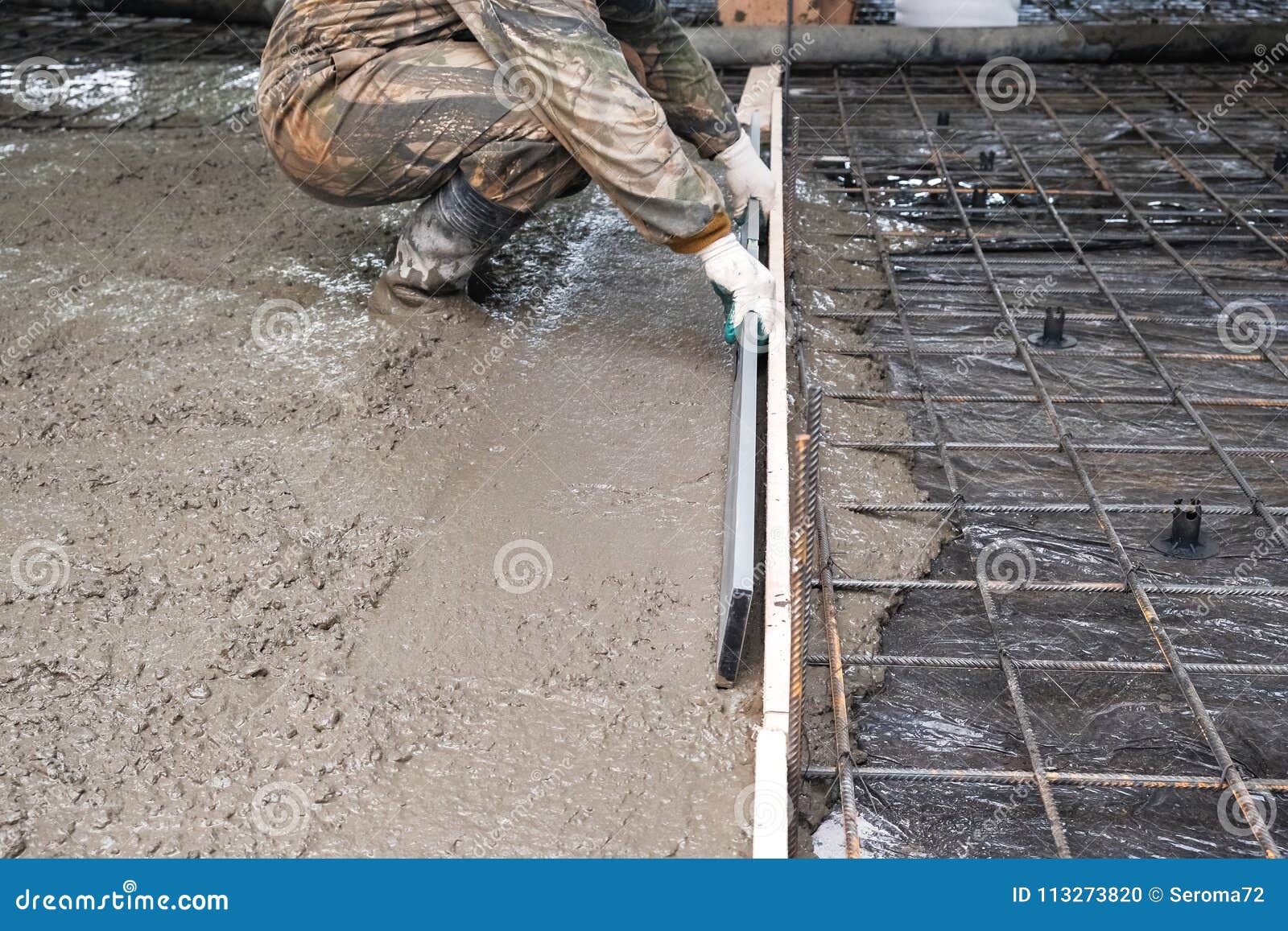 Pouring concrete slab stock photo. Image of surface - 113273820