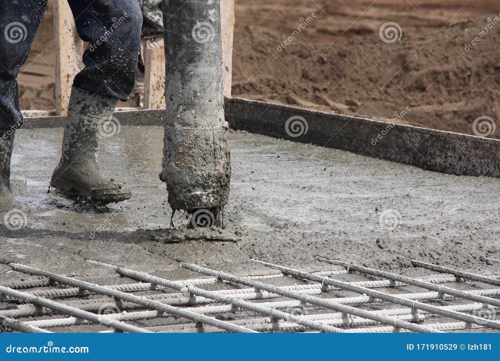 Concreting The Base Of The Building. Construction Worker Concrete ...