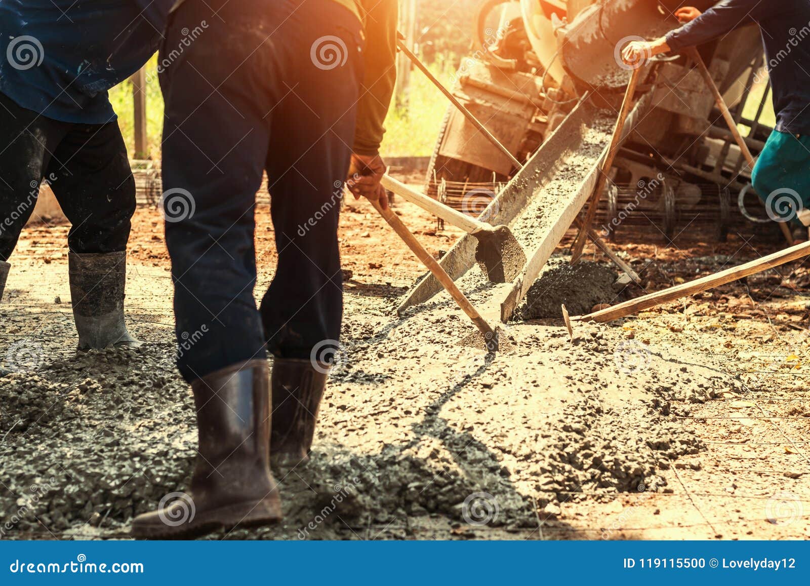 Pouring Concrete with Worker Mix Cement for Building Road at Con Stock ...