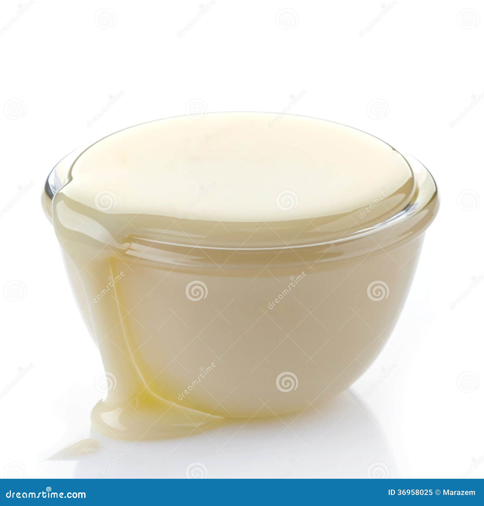 Condensed Milk Or Evaporated Milk In Bowl On Blue Table Top View ...