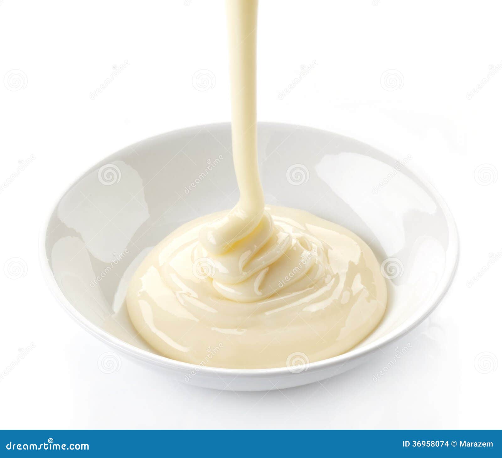 Condensed Milk Or Evaporated Milk In Bowl On Blue Table Top View ...