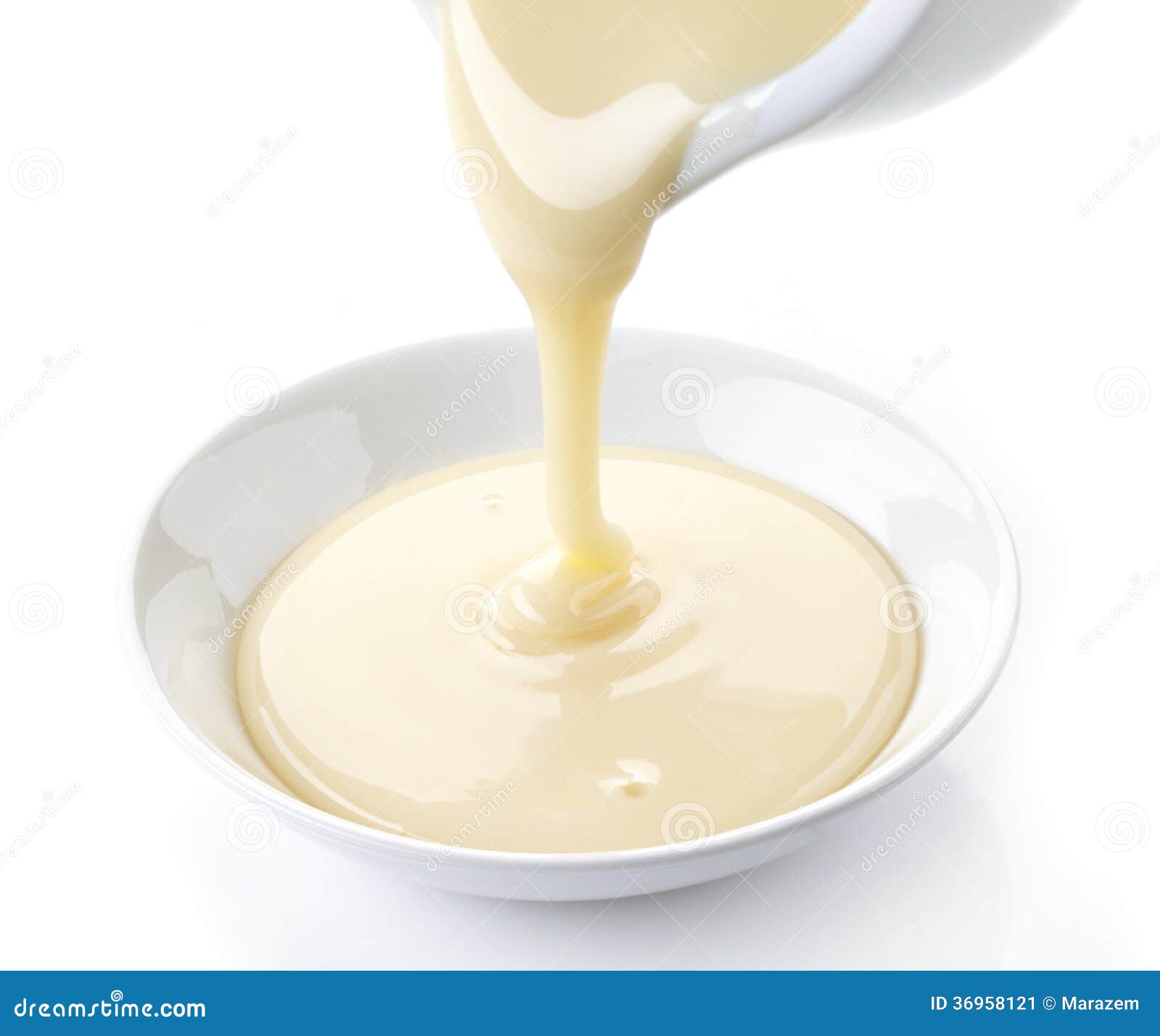 Condensed Milk Or Evaporated Milk In Bowl On Blue Table Top View ...
