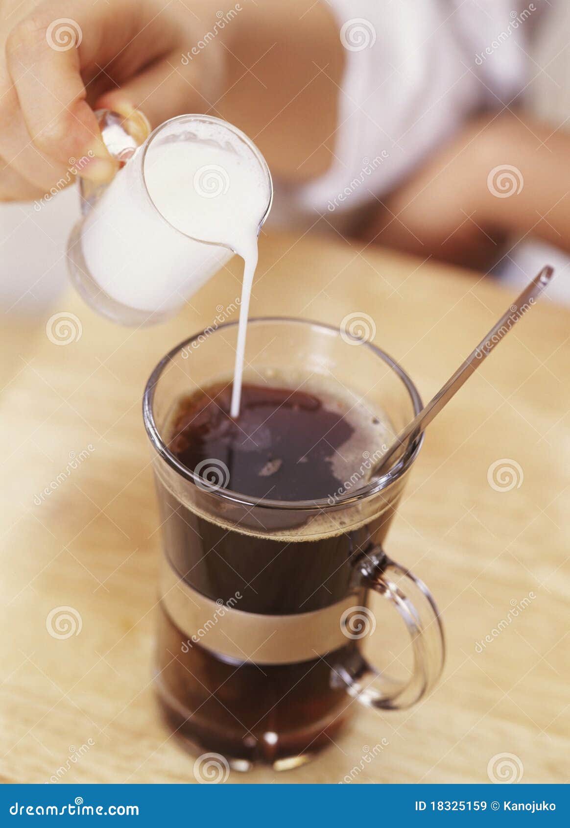 Pouring Cream into Coffee stock image. Image of pouring - 18325159