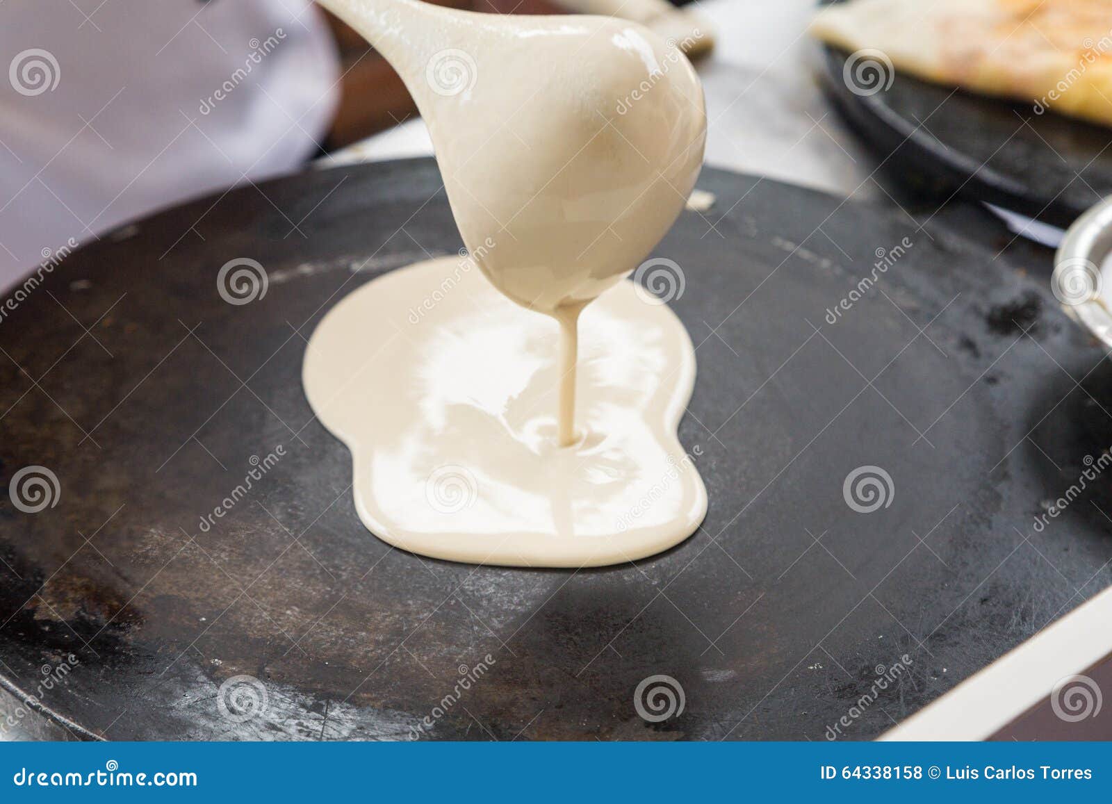 Pouring crepe dough stock photo. Image of baking, bowl - 64338158