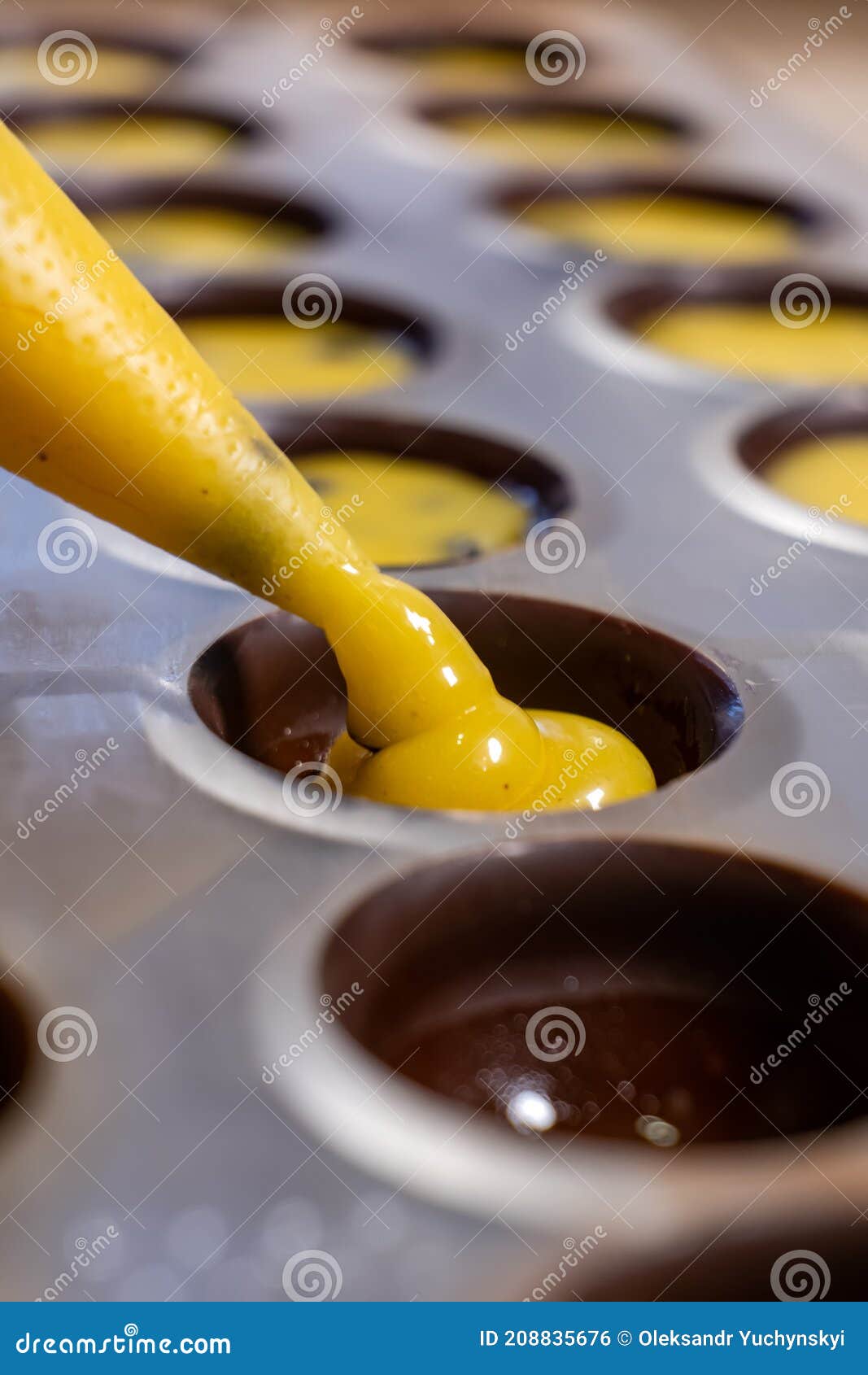 Pouring the Filling into Candies during the Manufacturing Process Stock ...