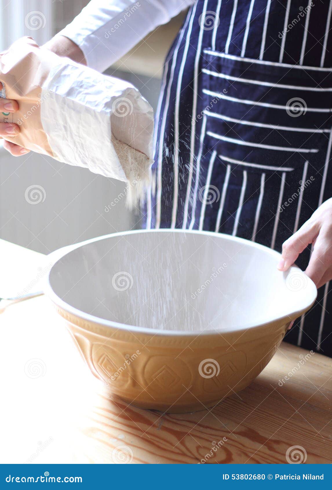 Pouring flour in a bowl stock photo. Image of table, wholemeal - 53802680