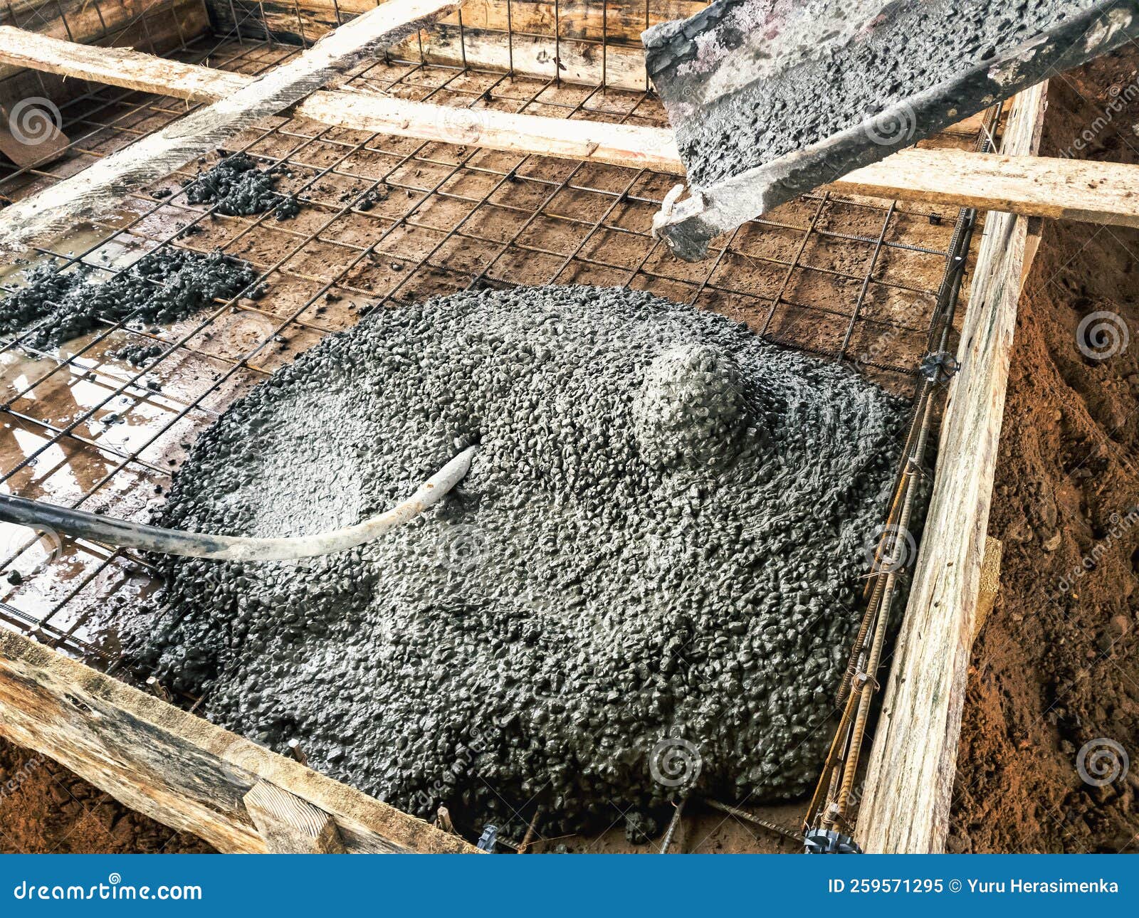 Pouring the Foundation with Concrete at the Construction Site ...