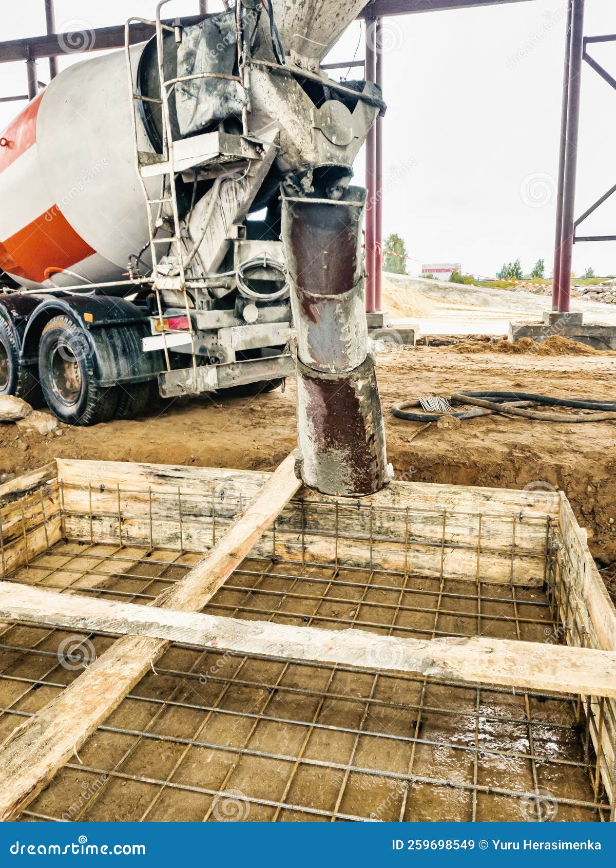 Pouring the Foundation with Concrete at the Construction Site ...
