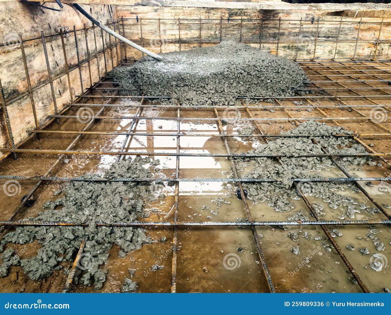 Pouring the Foundation with Concrete at the Construction Site ...