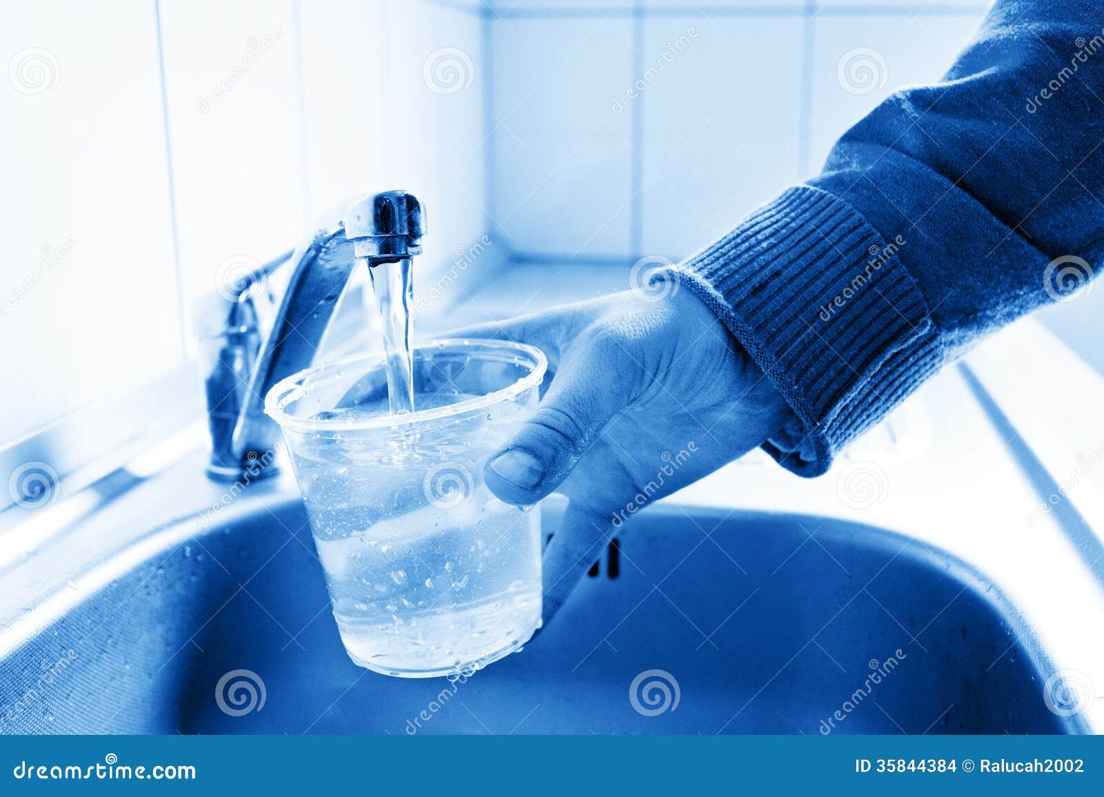 Pouring fresh Tap Water stock photo. Image of gushing - 35844384