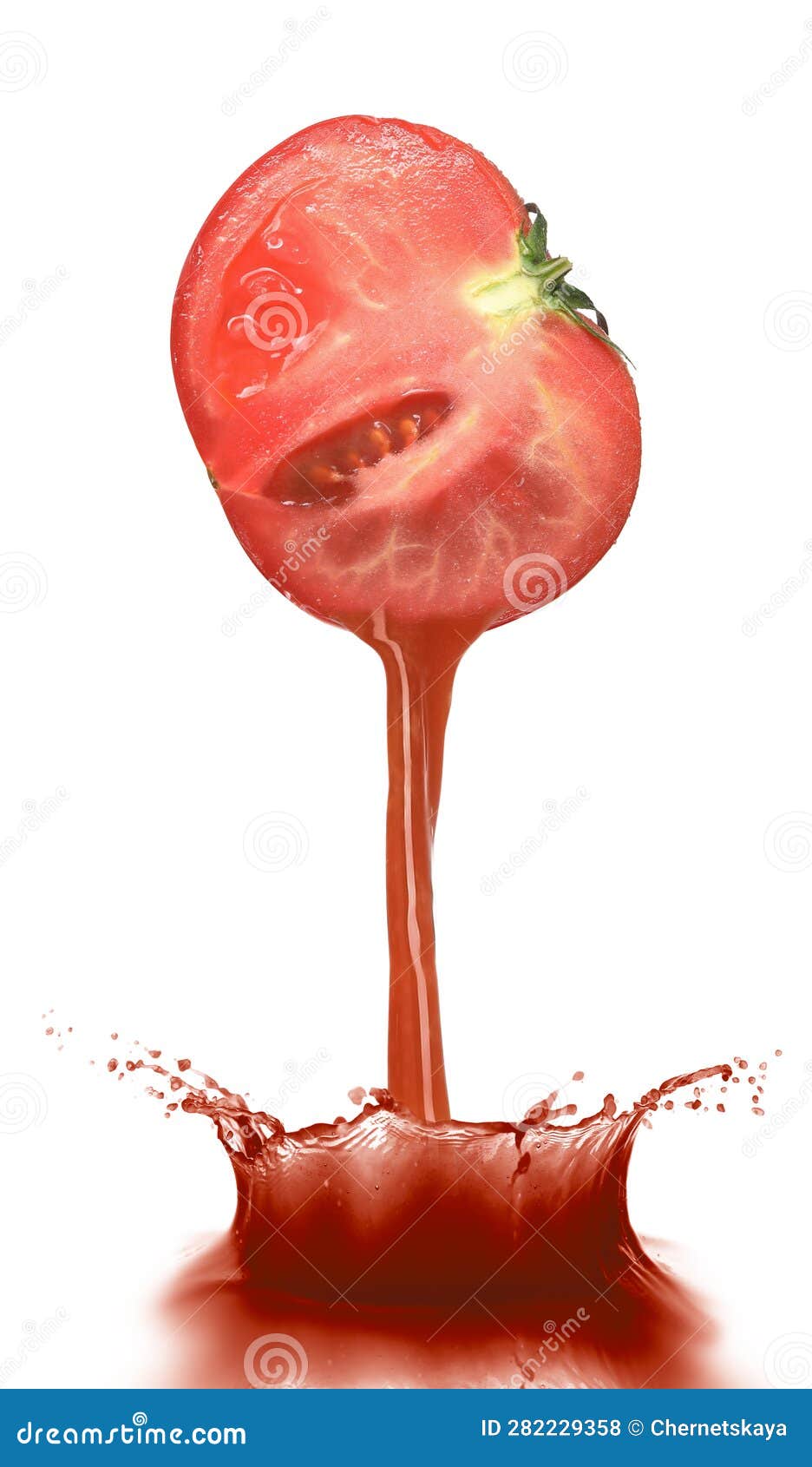 Pouring Freshly Squeezed Juice from Tomato on White Background Stock ...