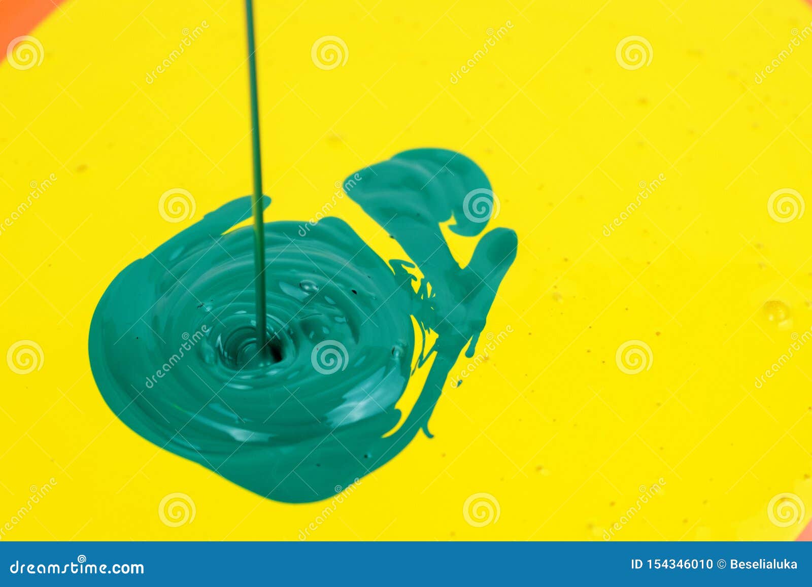 Pouring green paint stock photo. Image of flowing, drop - 154346010