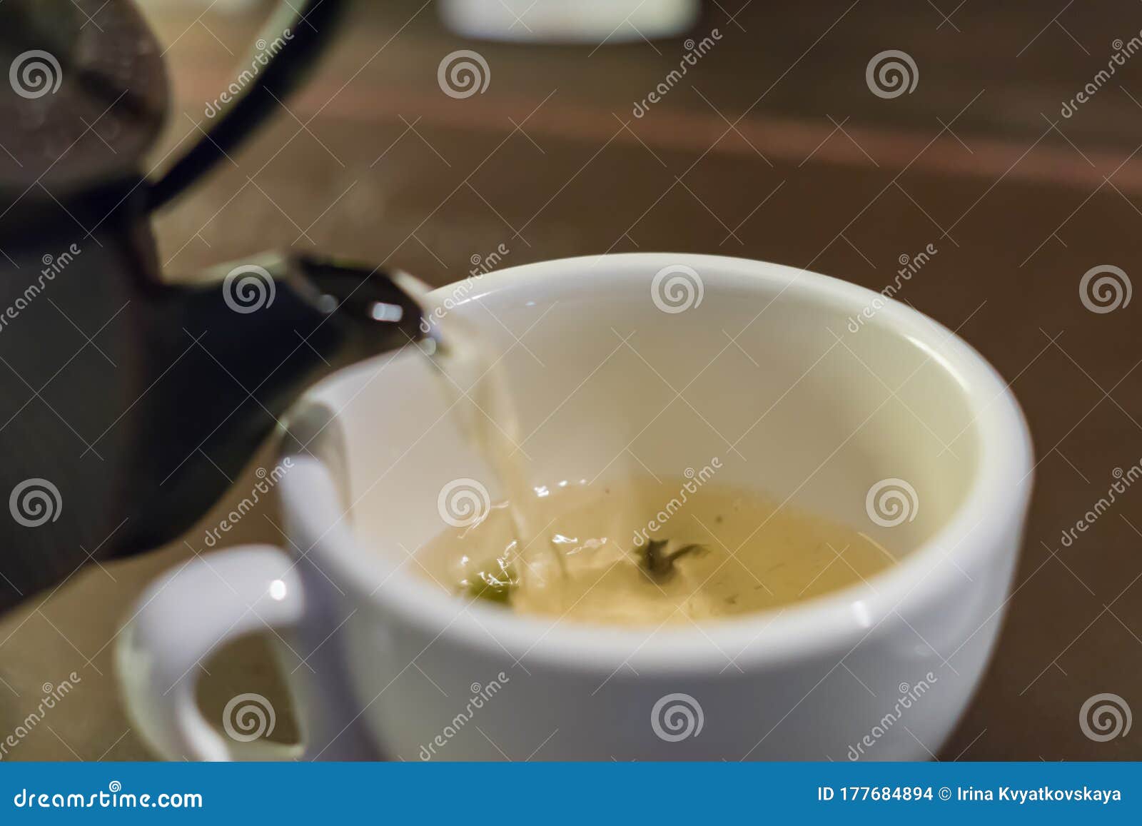 Pouring green tea into cup stock photo. Image of china - 177684894