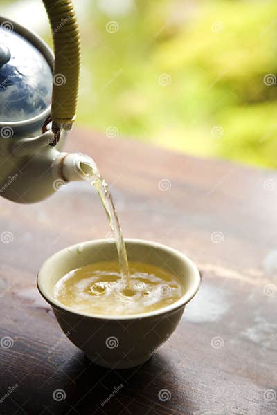 Pouring Green Tea from Pot stock image. Image of fresh - 7694829
