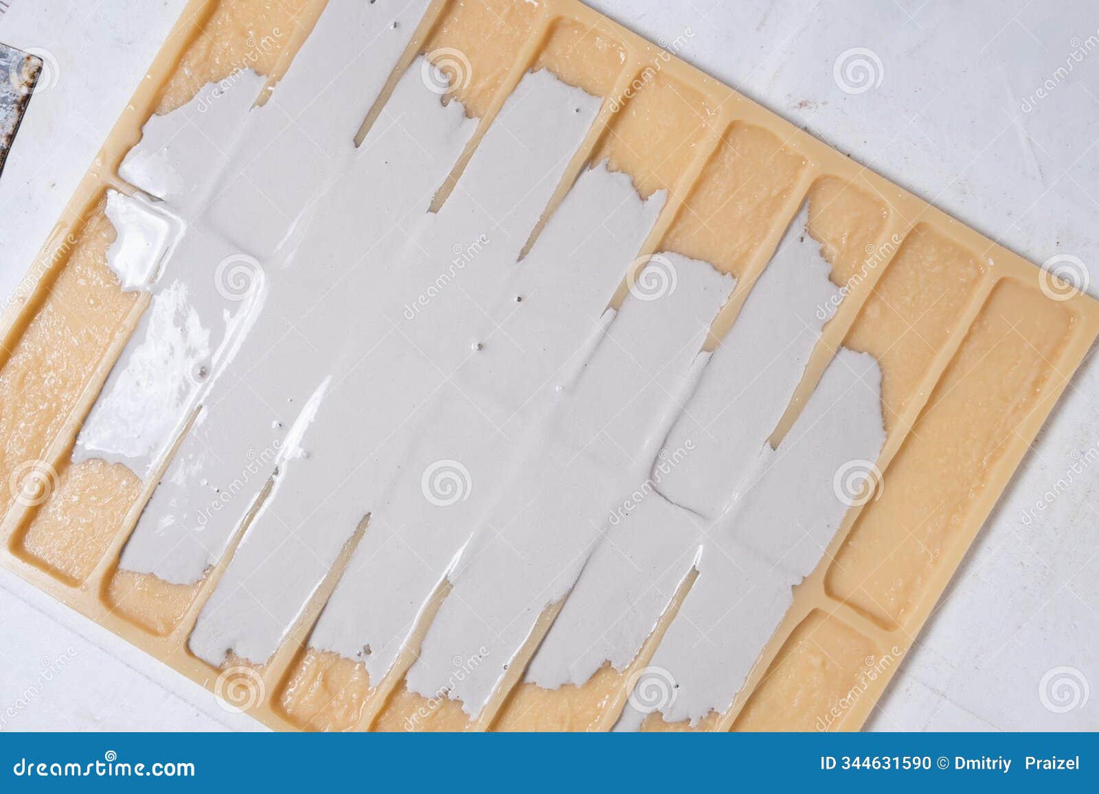 Pouring Gypsum into a Mold for Making Decorative Bricks Stock Photo ...