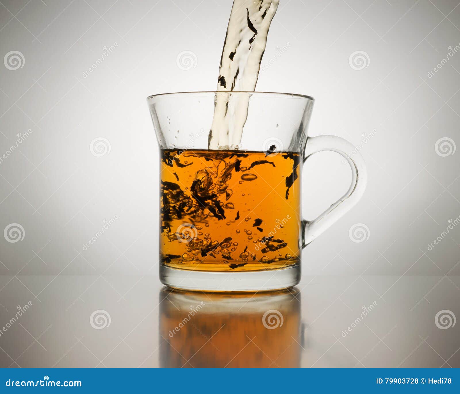 Pouring hot tea stock photo. Image of infusion, backlight - 79903728