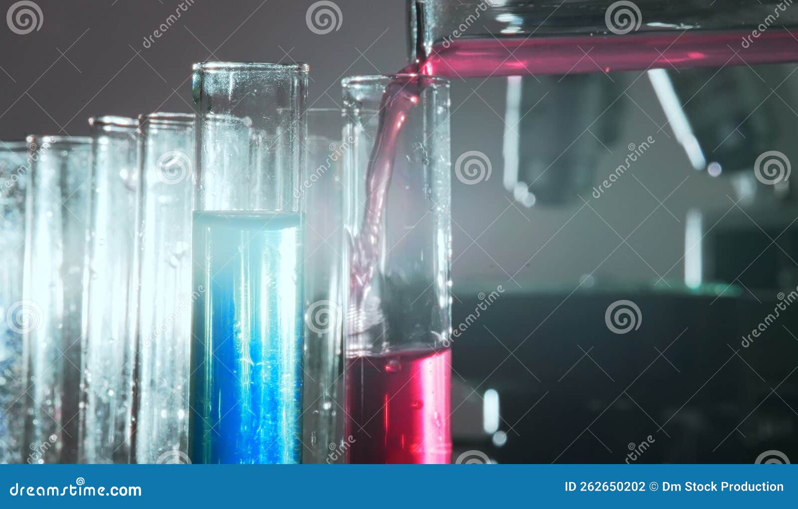 Pouring Liquid into Test Tubes Stock Photo - Image of flask, chemistry ...