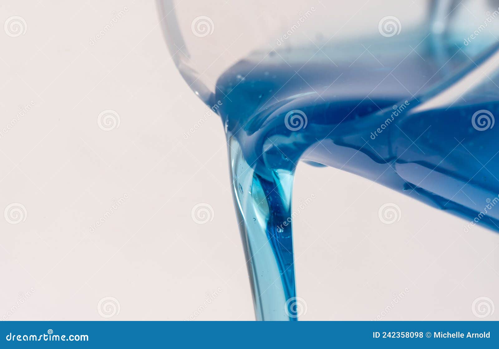 Pouring Liquid Laundry Soap from a Cup Stock Photo - Image of isolated ...