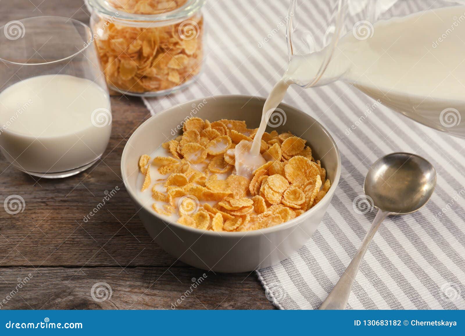 Pouring Milk into Bowl with Healthy Cornflakes Stock Photo - Image of ...