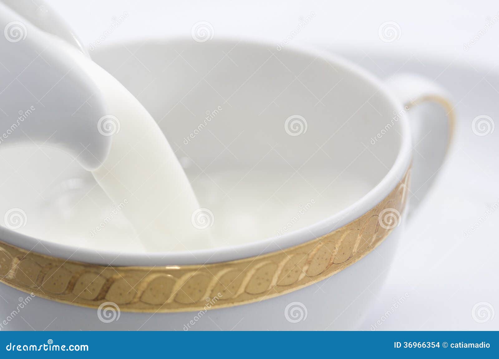 Pouring milk in cup stock photo. Image of closeup, pouring - 36966354